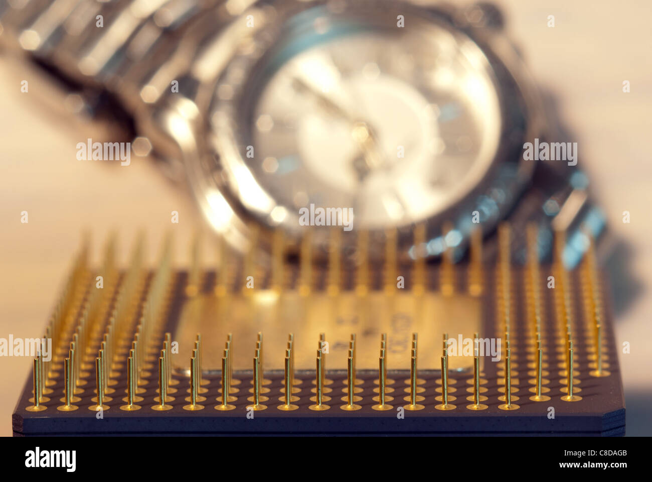 Back of a Intel CPU with a watch in the background Stock Photo - Alamy