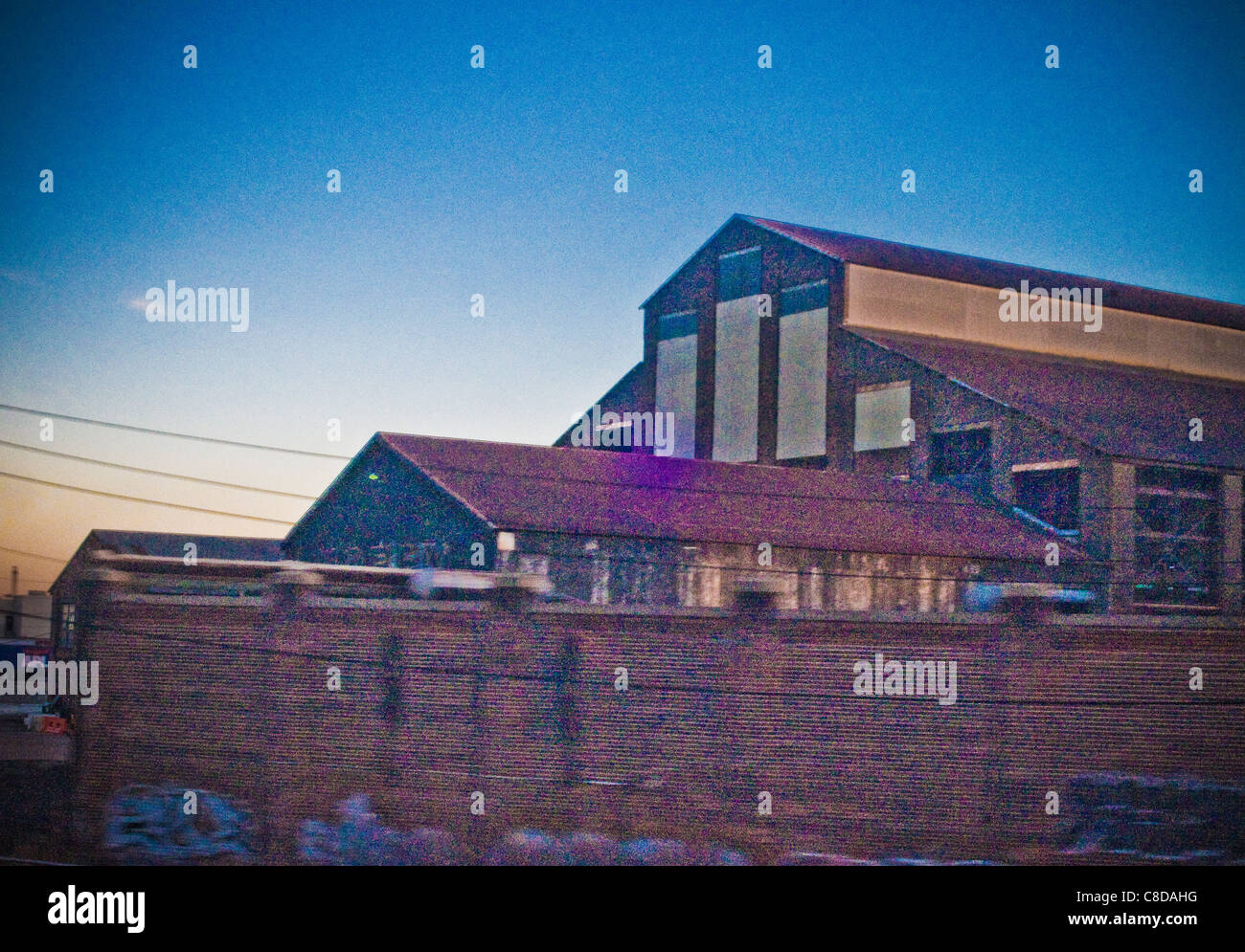Industrial buildings at dusk Stock Photo - Alamy