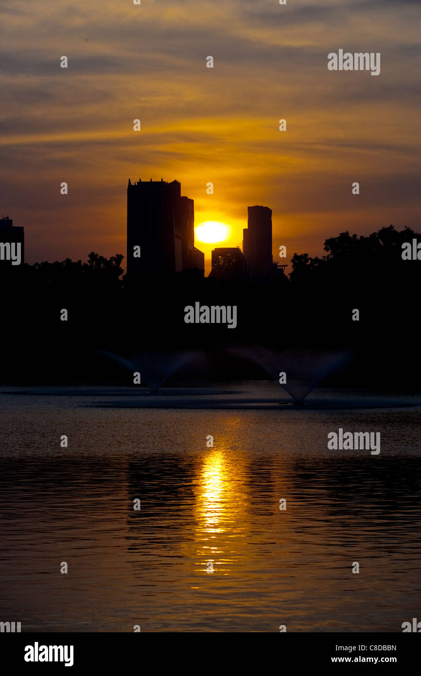 Picture of buildings with sun setting in the background Stock Photo - Alamy