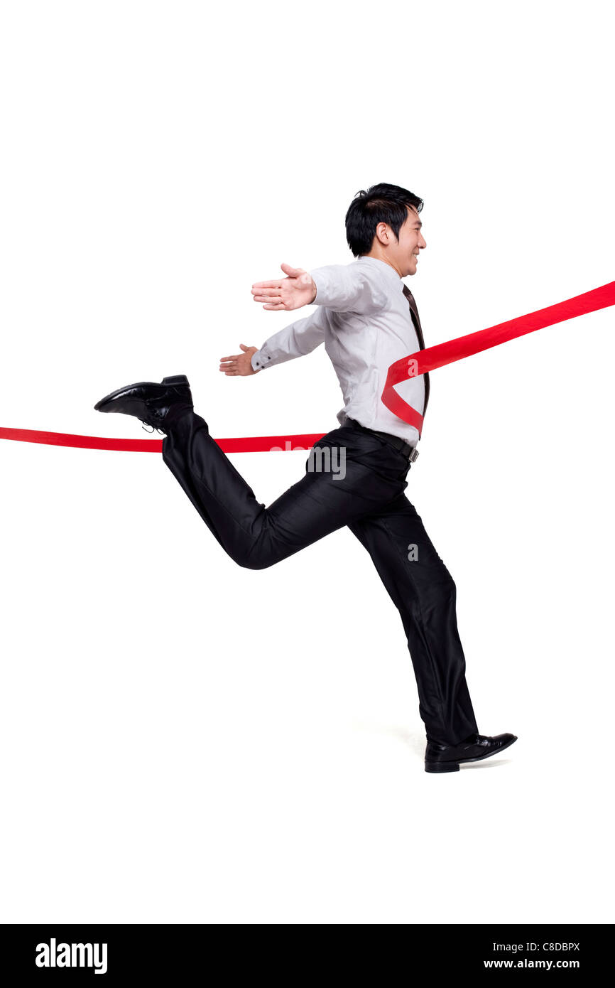 Side view crossing the finish line Cut Out Stock Images & Pictures - Alamy