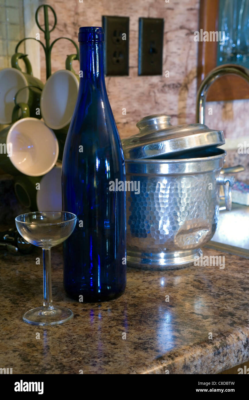 Kitchen countertop with cups, bottle and ice container Stock Photo - Alamy