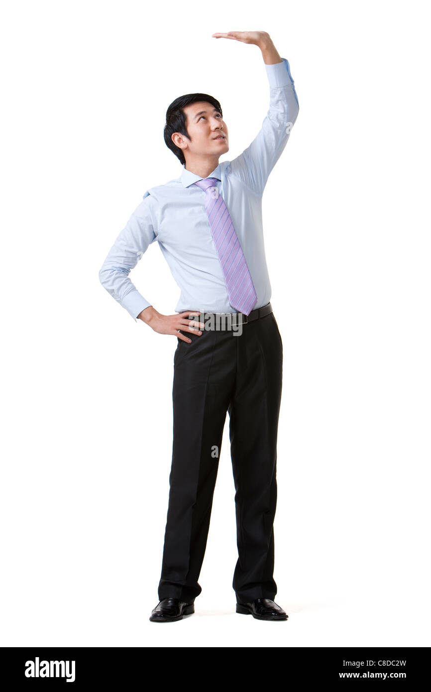 Businessman Carrying an Object Over His Head Stock Photo - Alamy