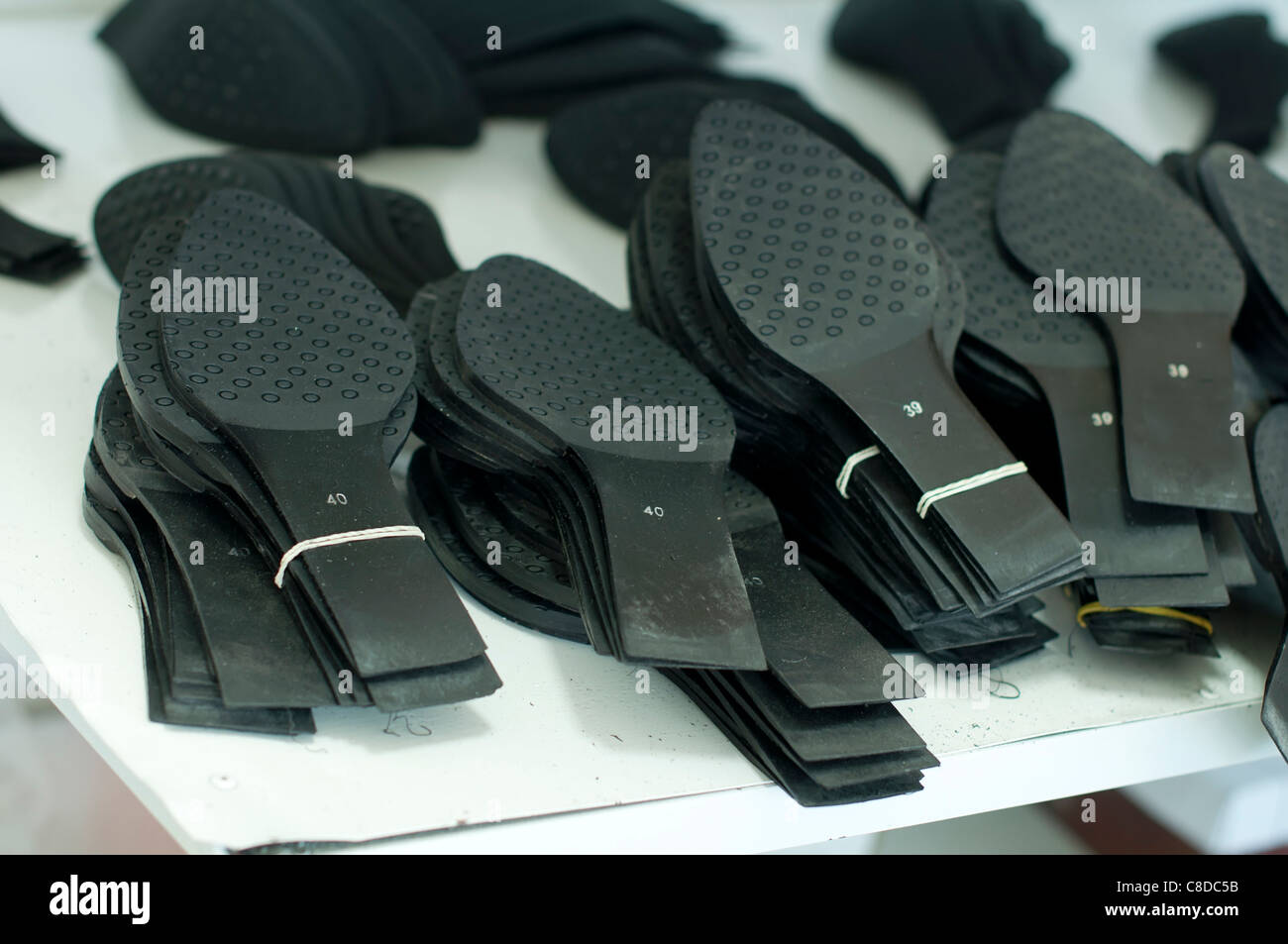 Rubber shoe factory hi-res stock photography and images - Alamy