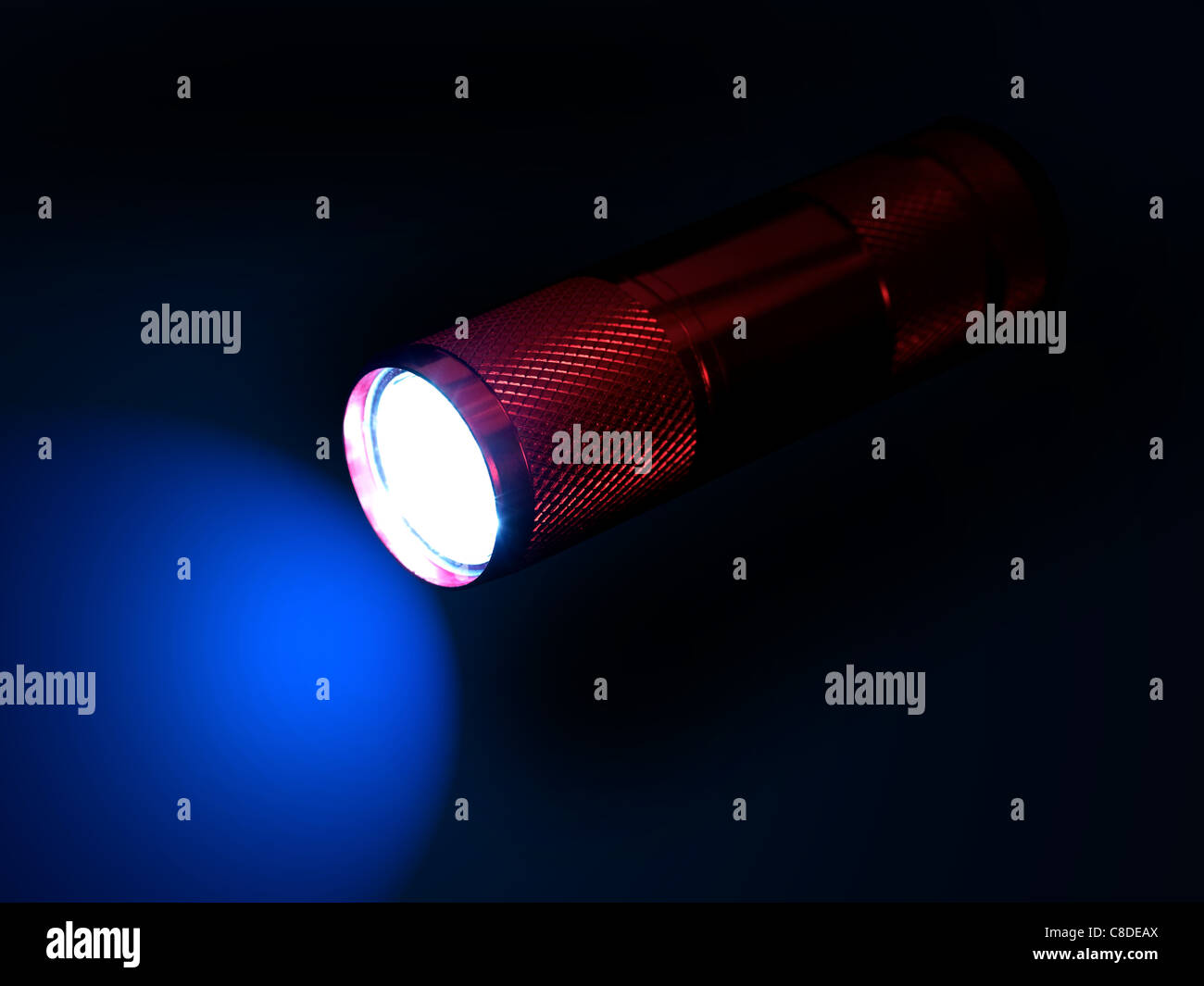 A flash light isolated against a black background Stock Photo - Alamy