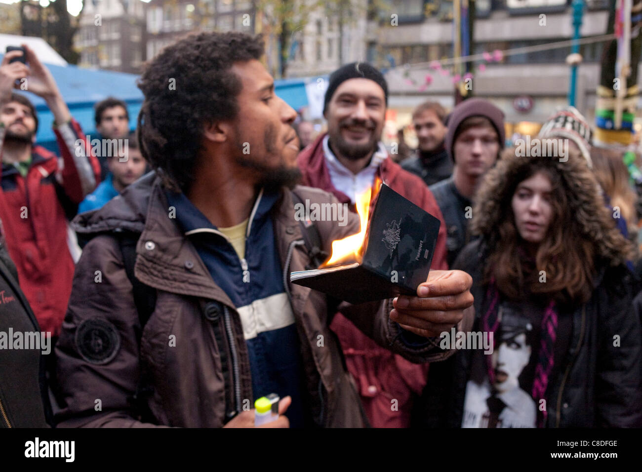 Protestor burning passport hi-res stock photography and images - Alamy
