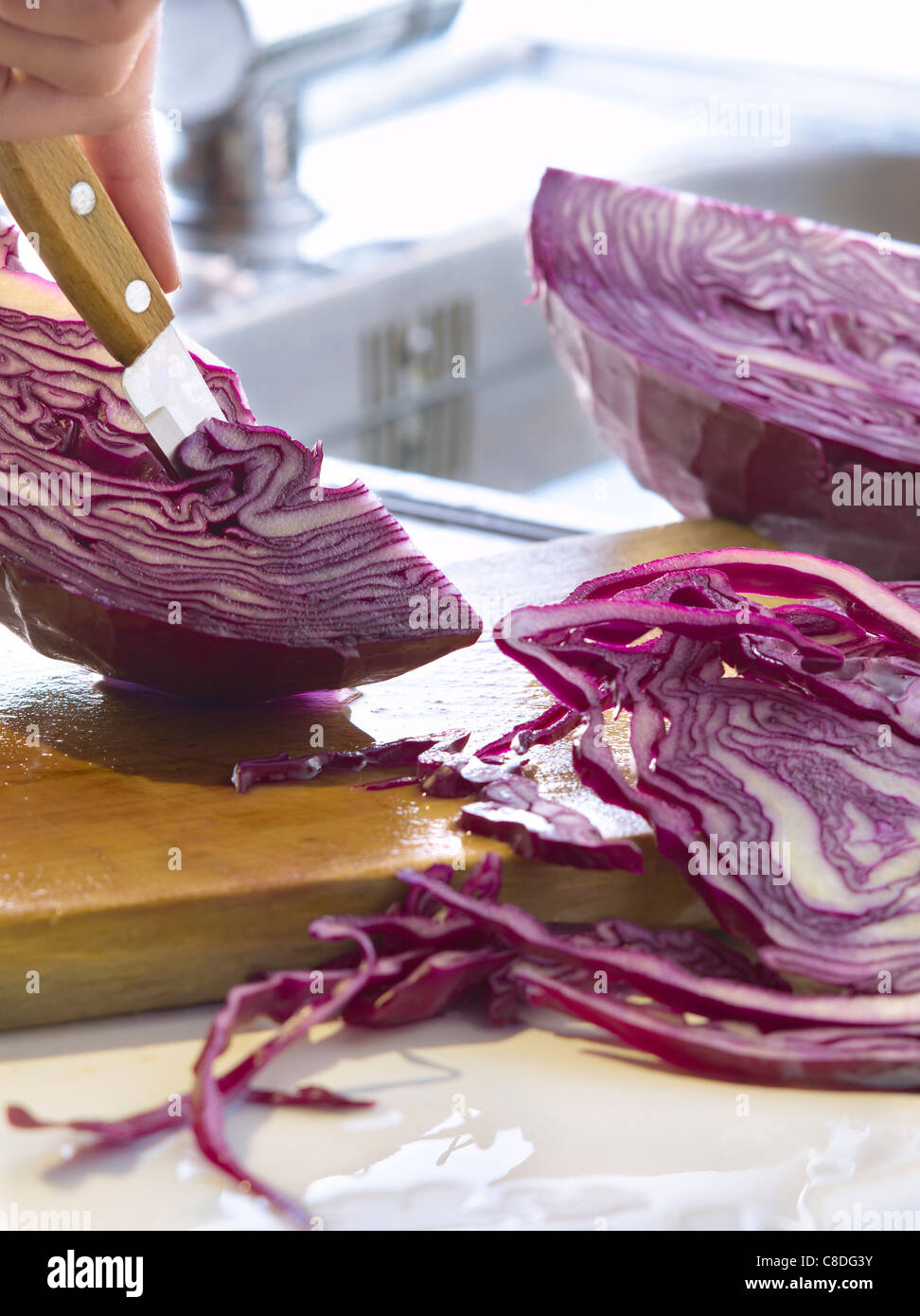 Slicing red cabbage Stock Photo - Alamy