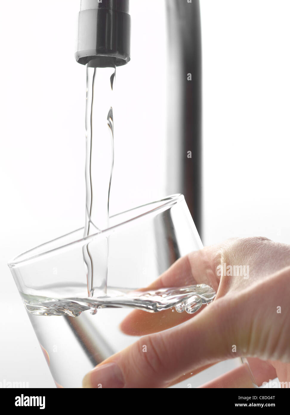 Filling a glass of water from the tap Stock Photo - Alamy