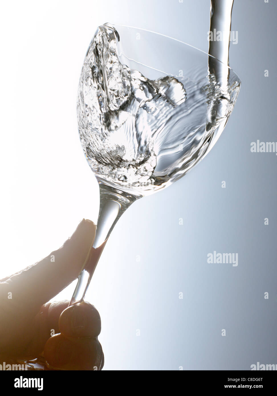 Filling a glass with tap water Stock Photo - Alamy