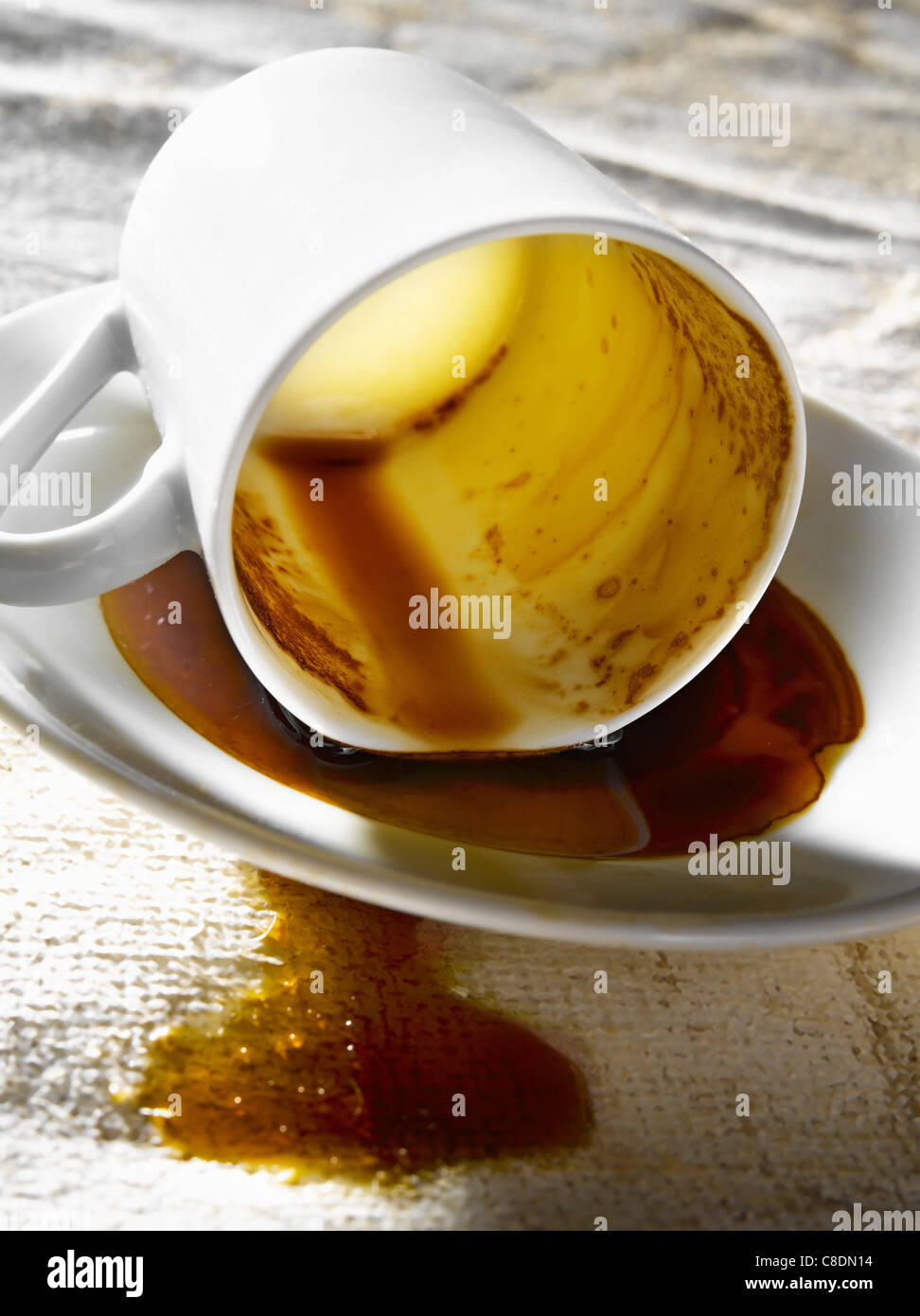 Spilt cup of coffee Stock Photo - Alamy