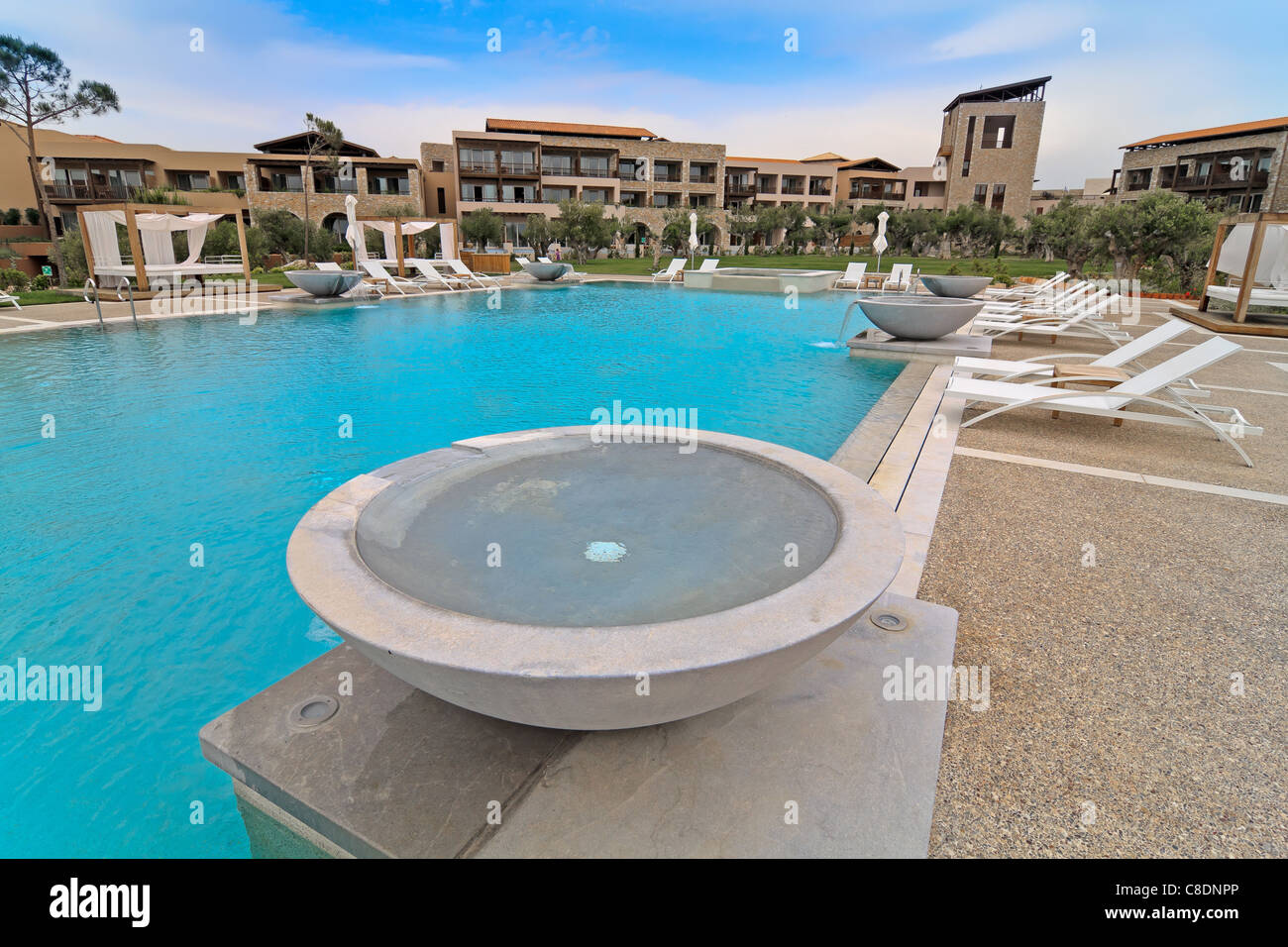 Luxury Resort Pool and chairs at hotel resort in Greece Stock Photo - Alamy