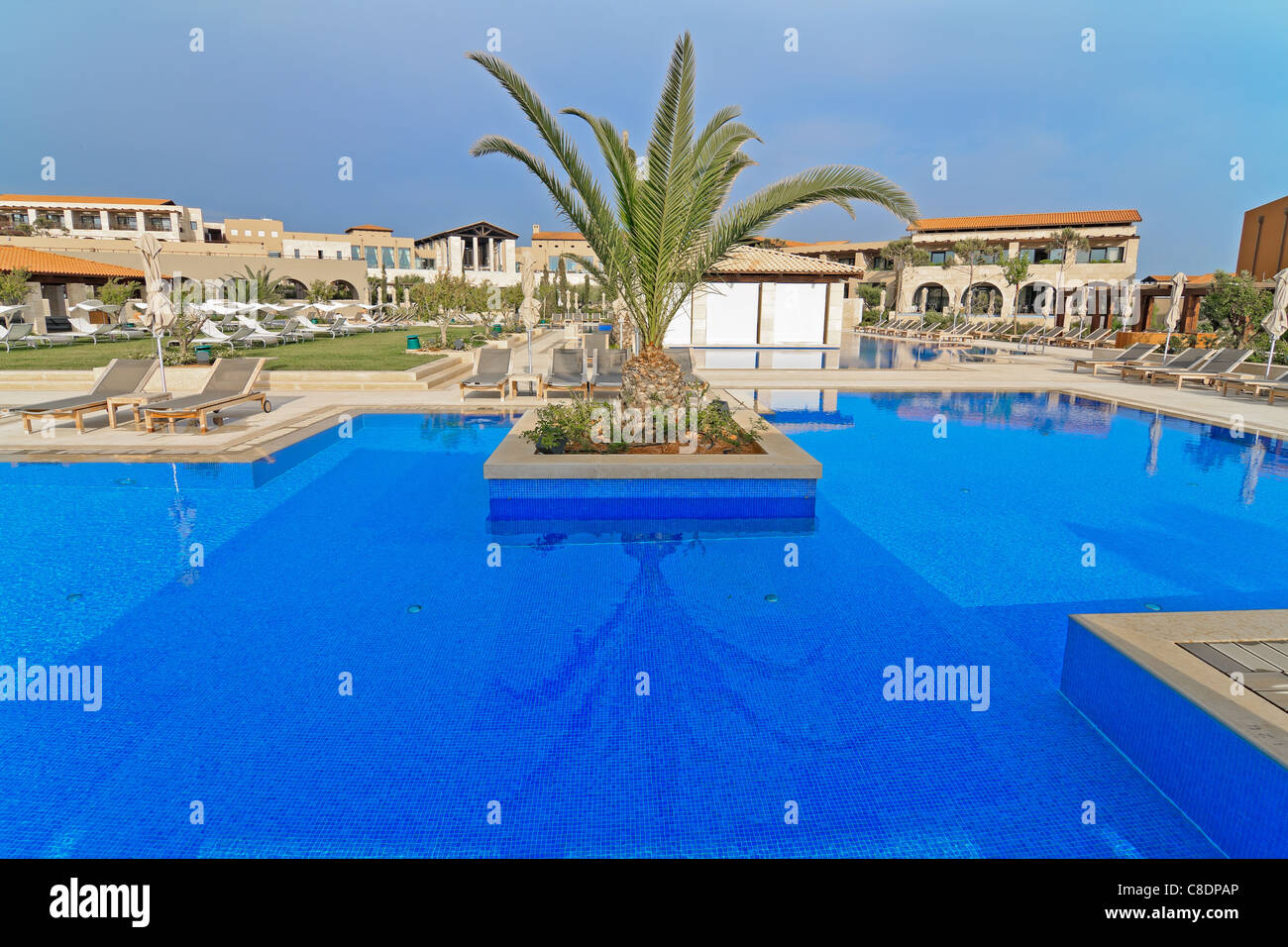 Luxury Resort Pool and chairs at hotel resort in Greece Stock Photo - Alamy