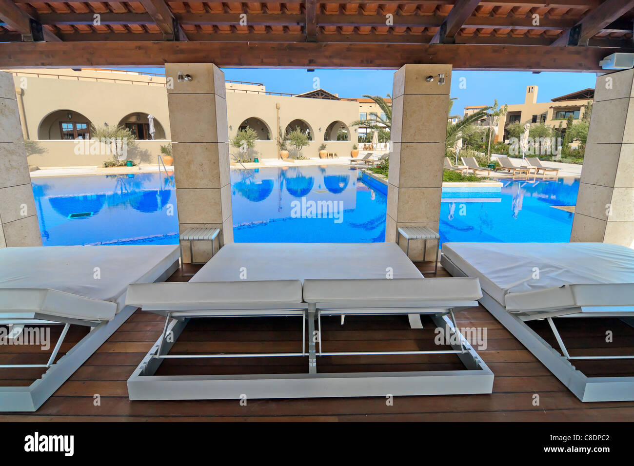 Luxury Resort Pool and chairs at hotel resort in Greece Stock Photo - Alamy