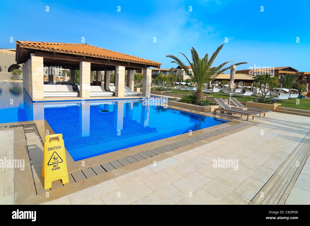 Luxury Resort Pool and chairs at hotel resort in Greece Stock Photo - Alamy
