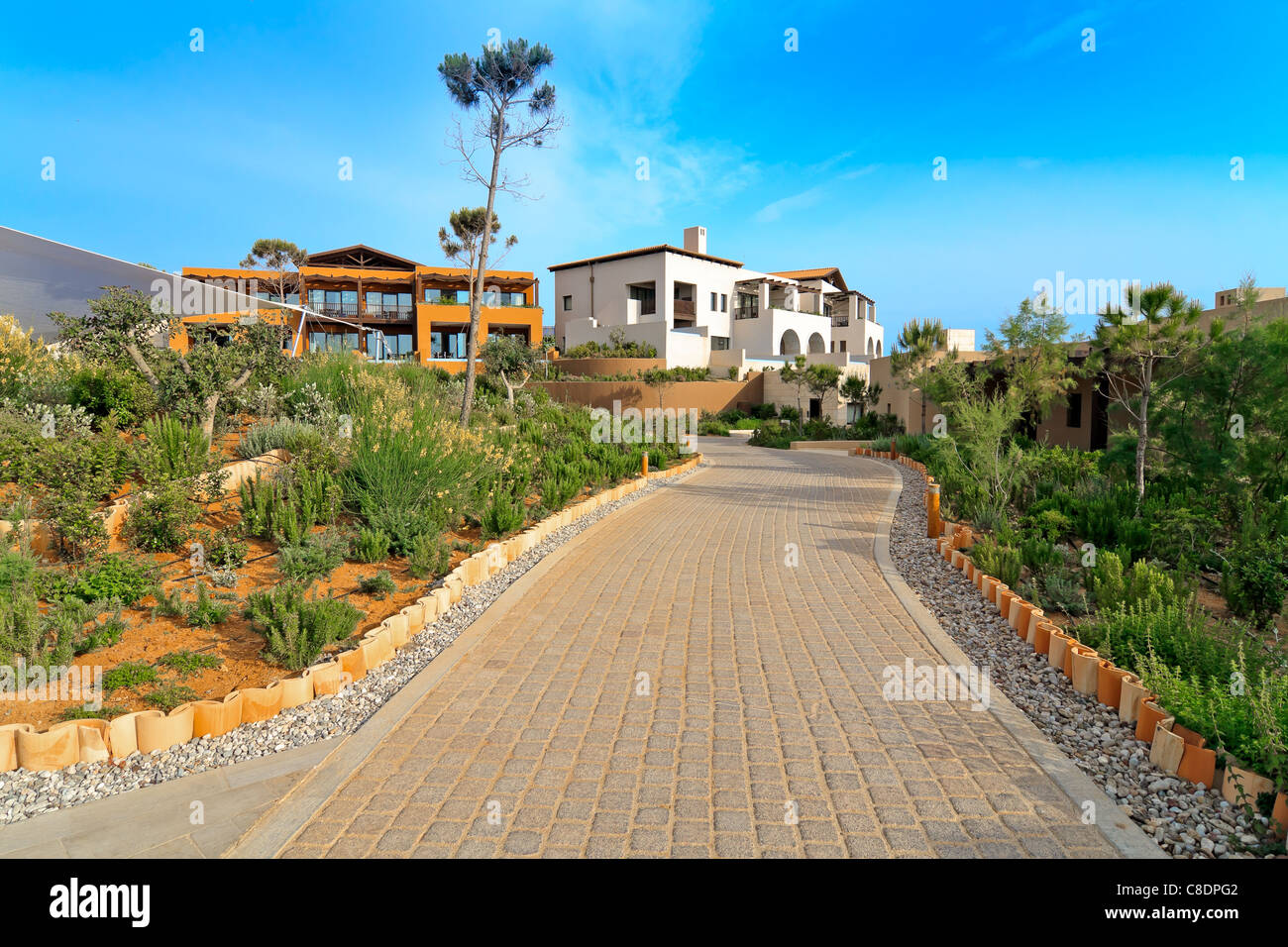 Stone pathway at resort in Greece in the afternoon Stock Photo - Alamy
