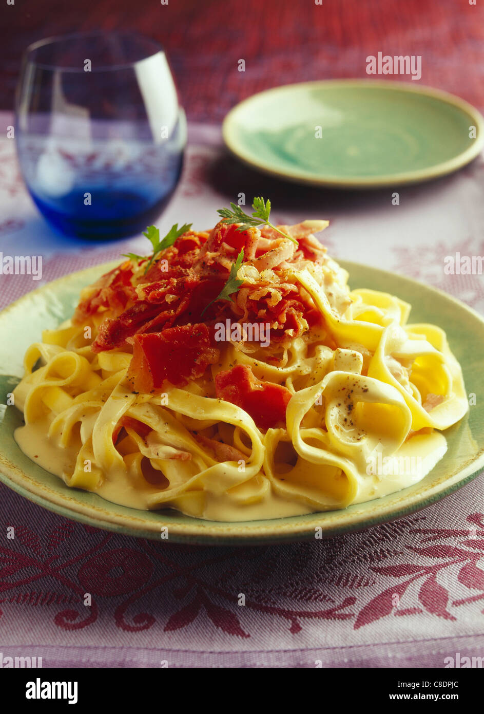 Tagliatelle with creamy sauce and ham hi-res stock photography and ...