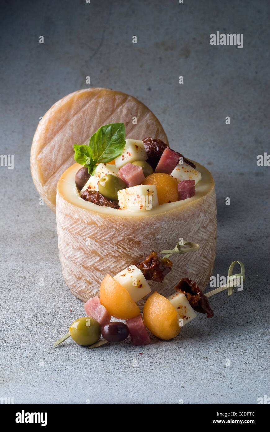Surprise Tomme cheese and small aperitif brochettes Stock Photo - Alamy