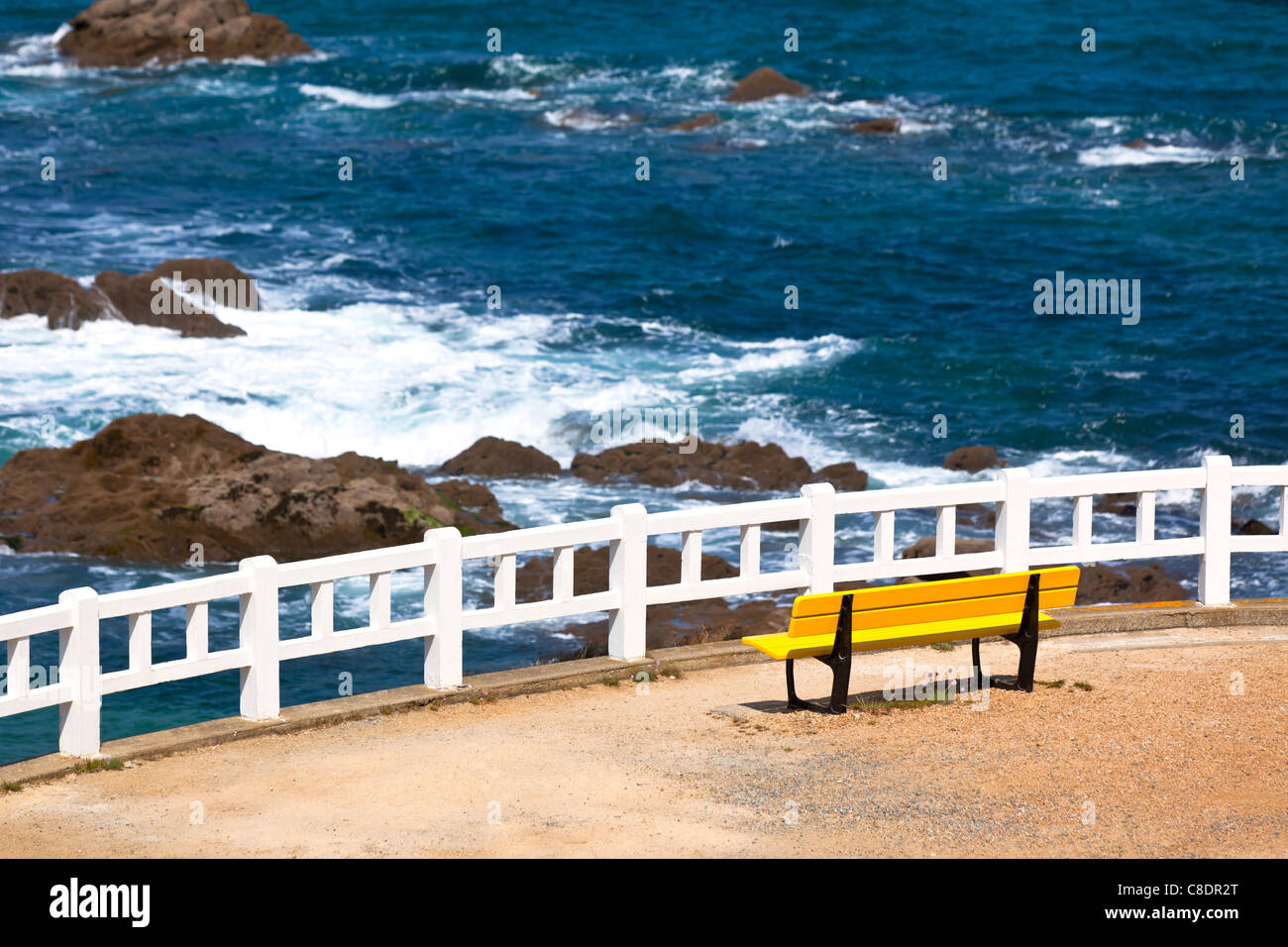 Empty yellow bench at Atlantic sea coastline Stock Photo - Alamy