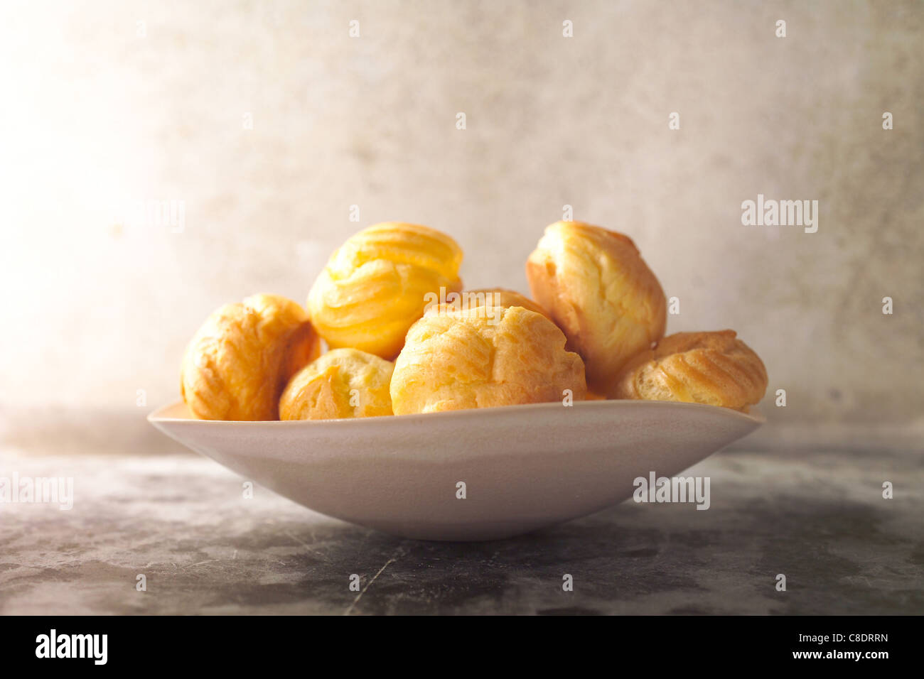 Small round puff pastries Stock Photo - Alamy