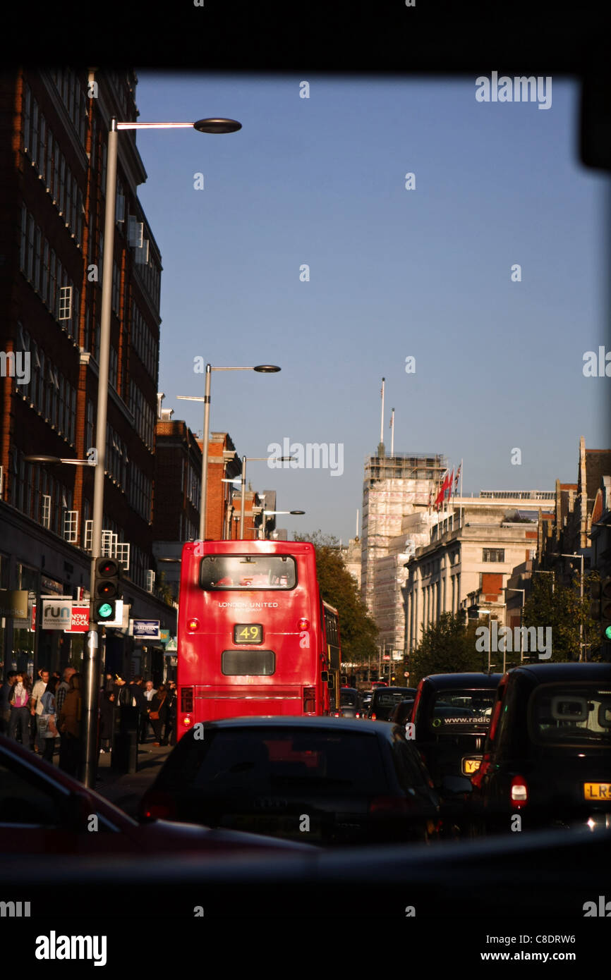 a queue of traffic viewed from inside a red London bus Stock Photo - Alamy