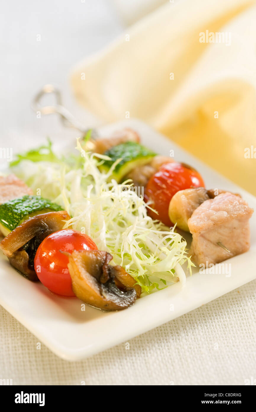 Rabbit and vegetable skewers Stock Photo - Alamy