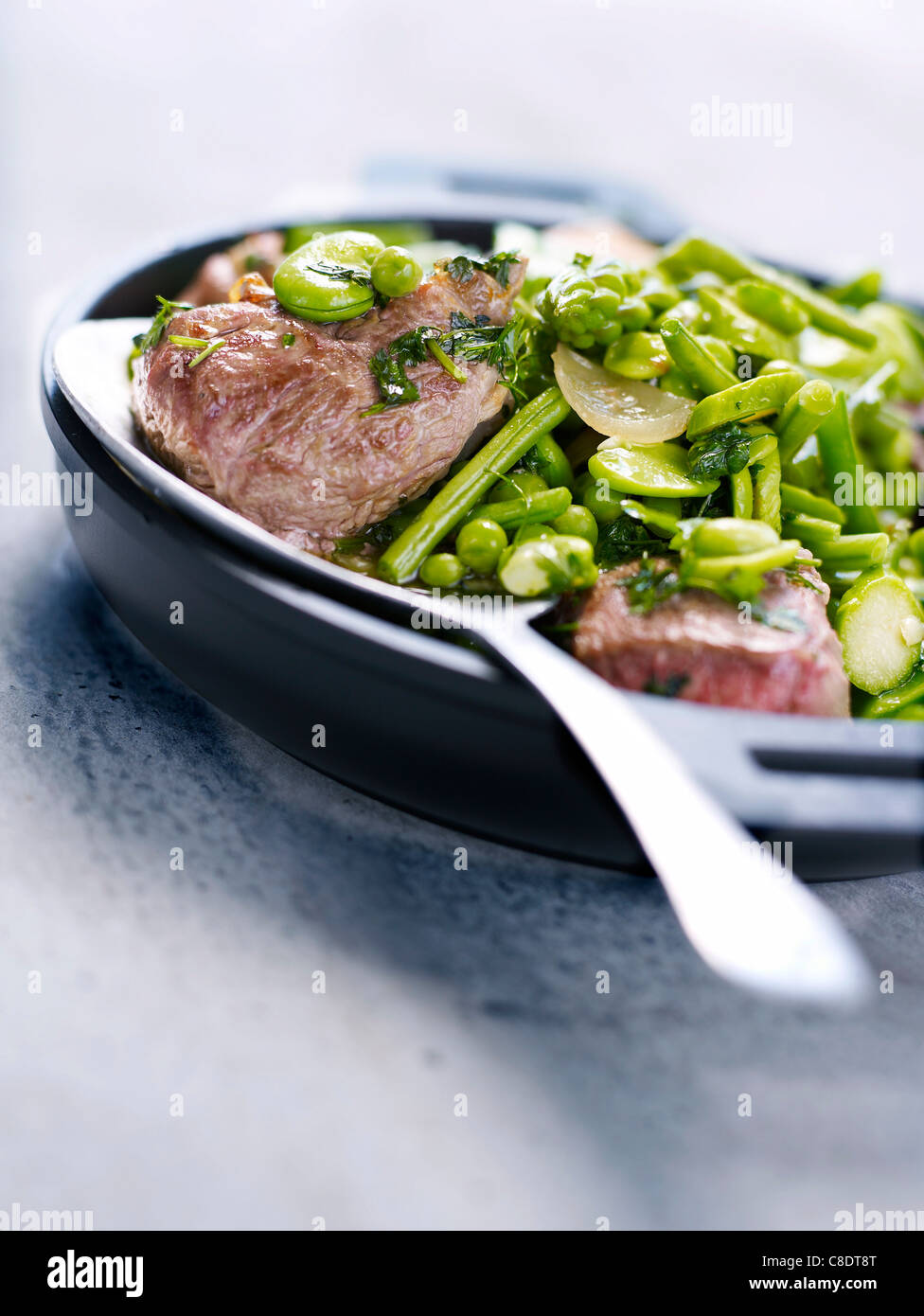 Lamb Navarin spring green vegetables Stock Photo - Alamy