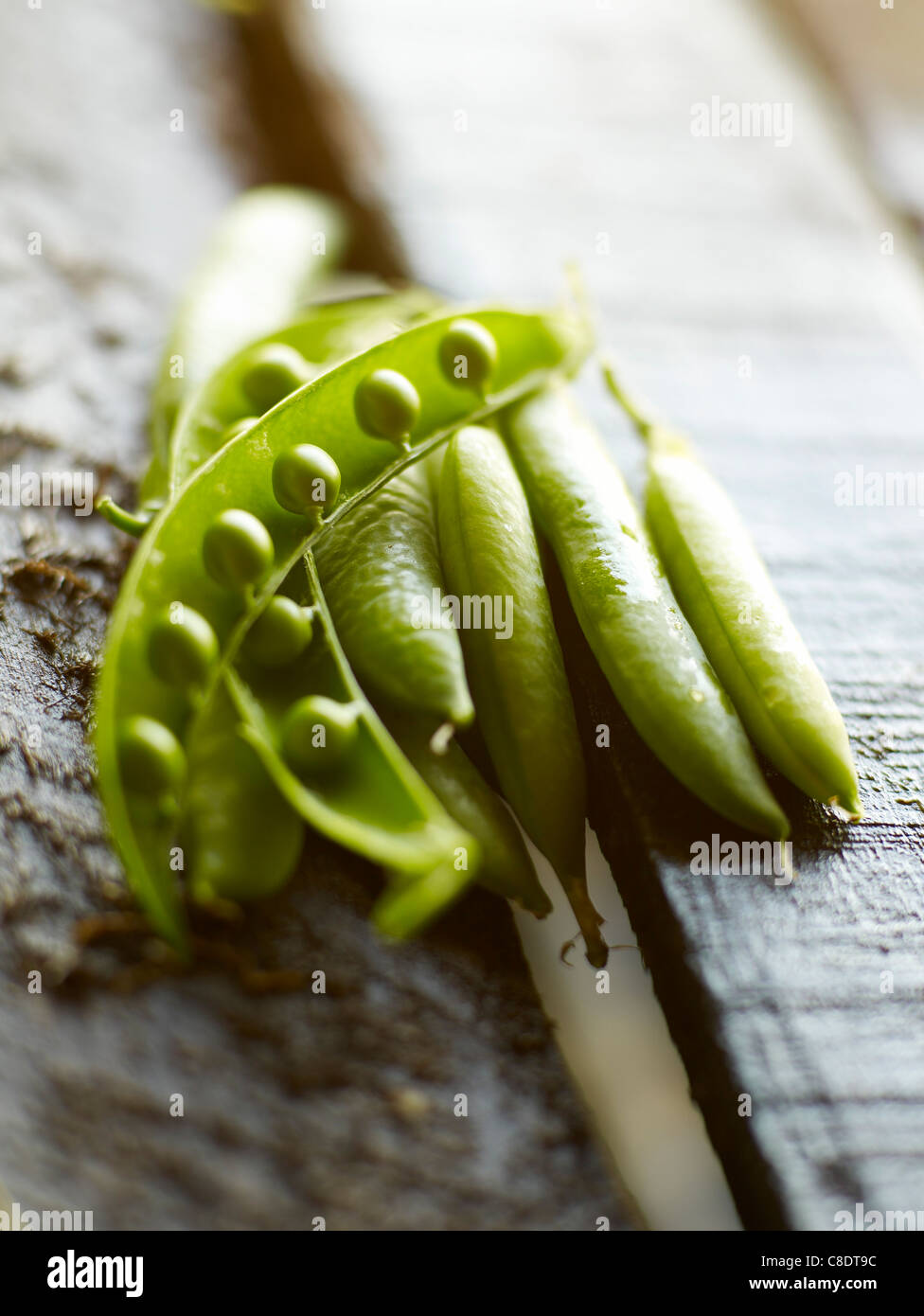 Peas with their pods Stock Photo - Alamy