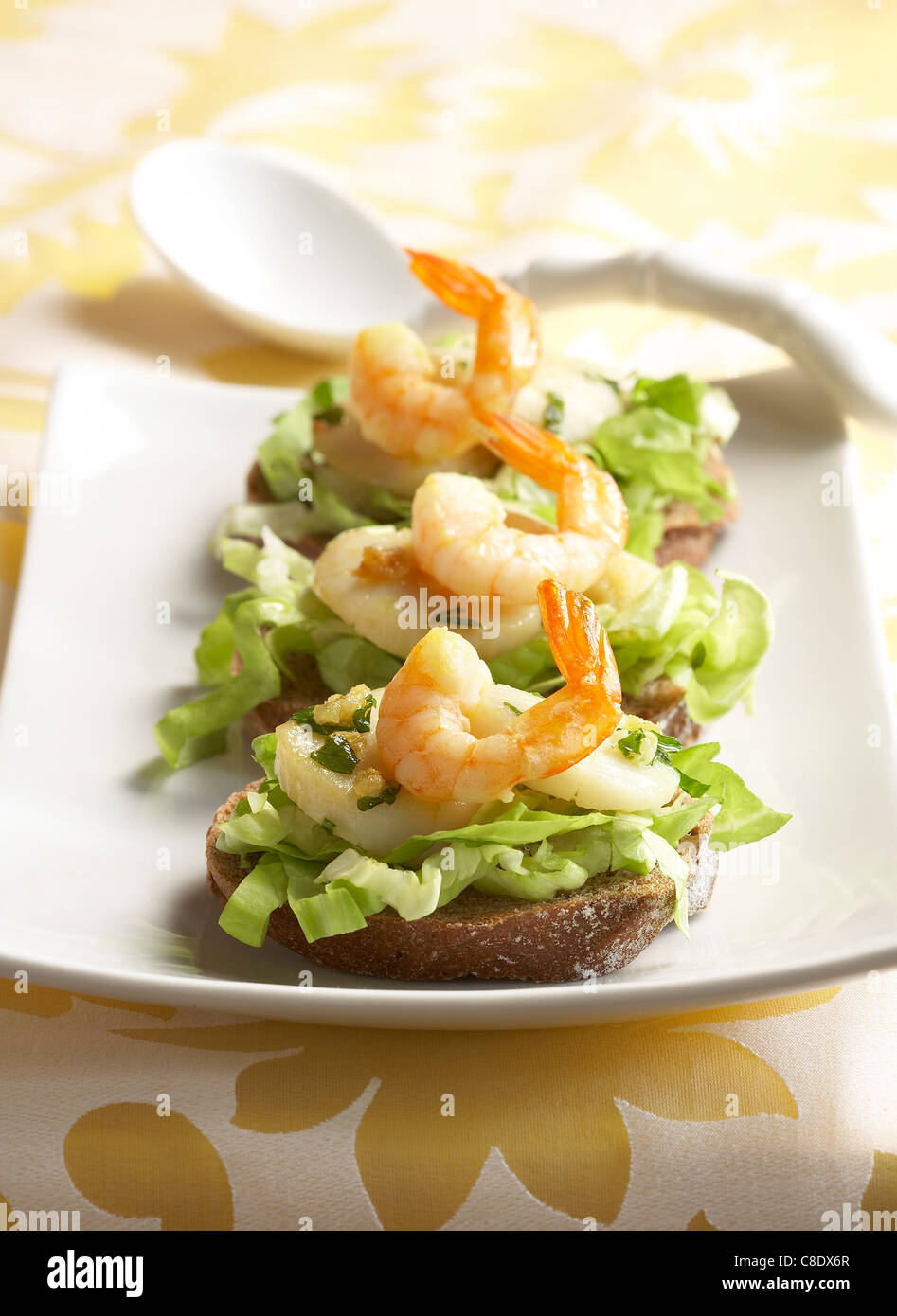 Scallops and shrimps on lettuce open sandwiches Stock Photo - Alamy