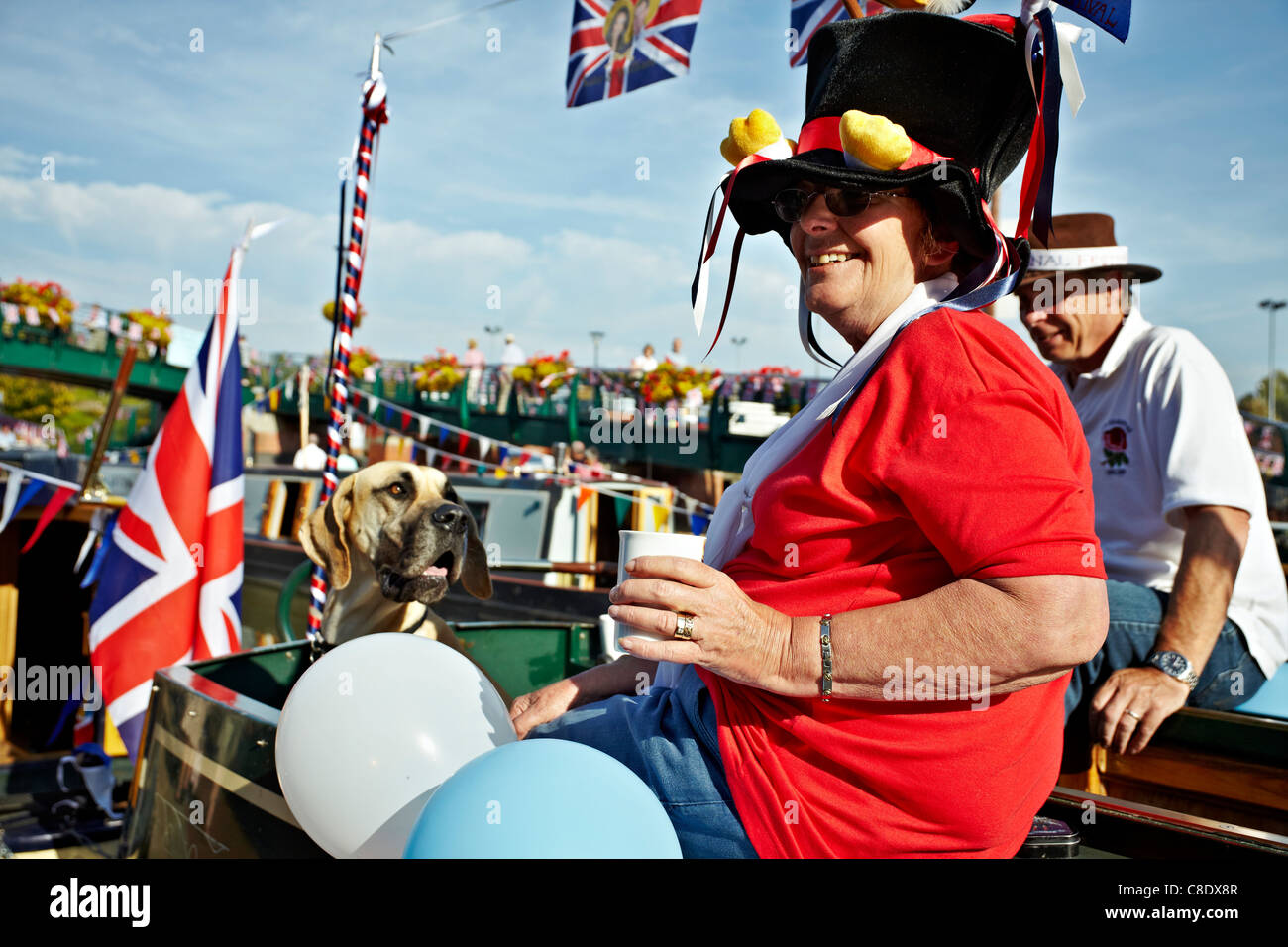 Colorful people scene of bargees and pet enjoying the festivities at ...