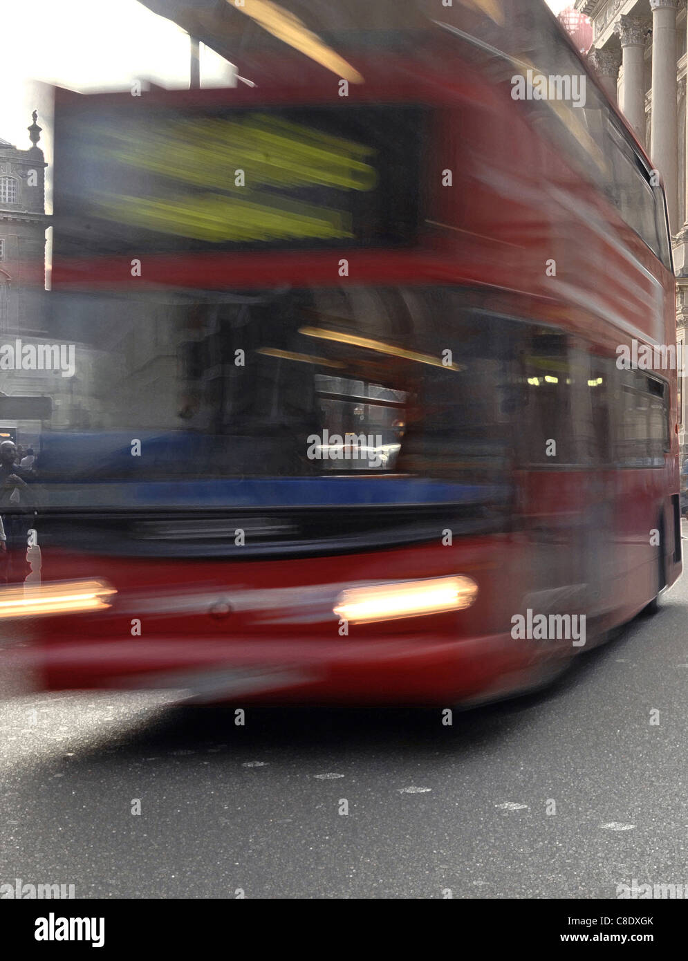 A red London bus sweeps past the camera. A slow exposure and Photoshop ...