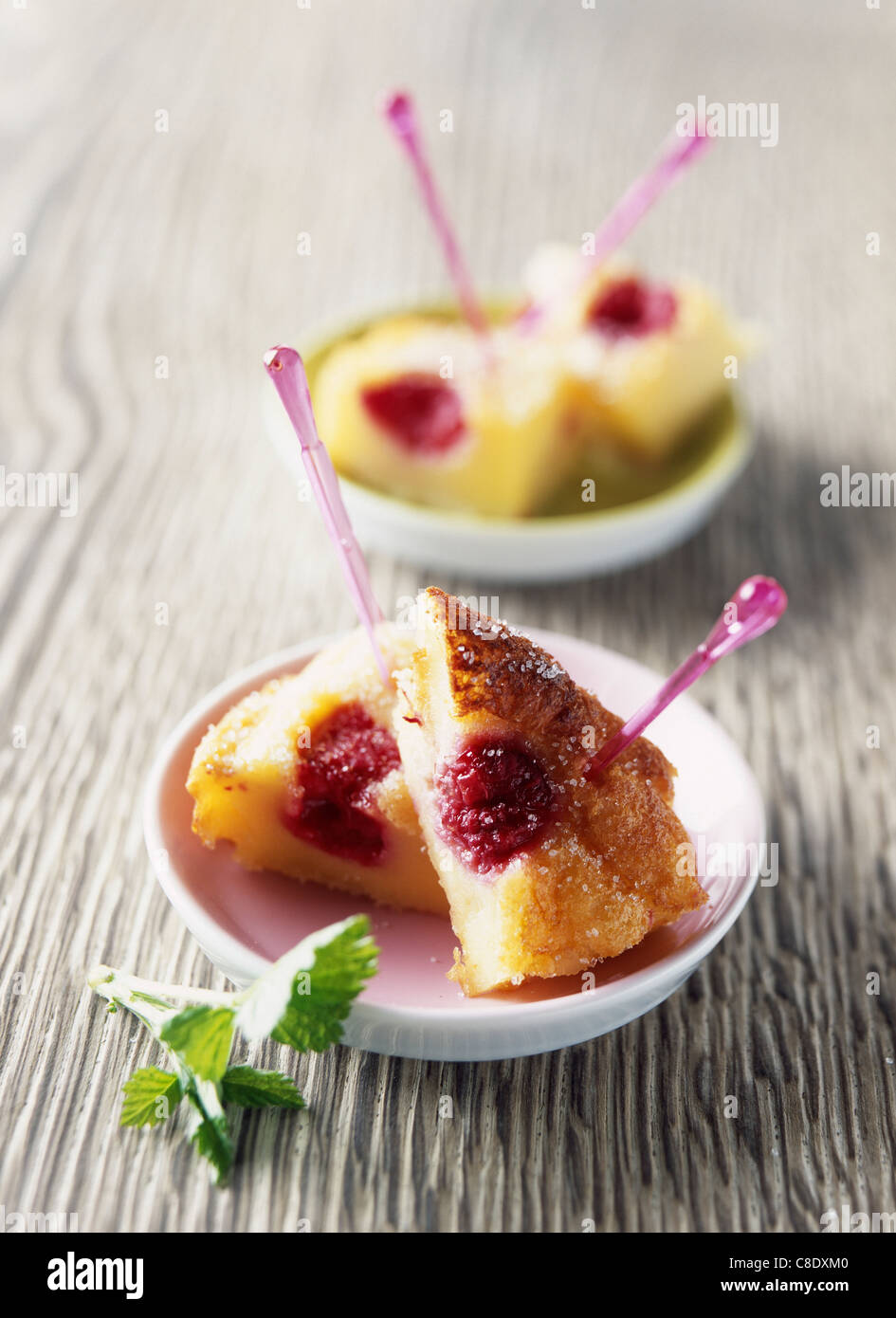 Small pieces of raspberry cake Stock Photo - Alamy