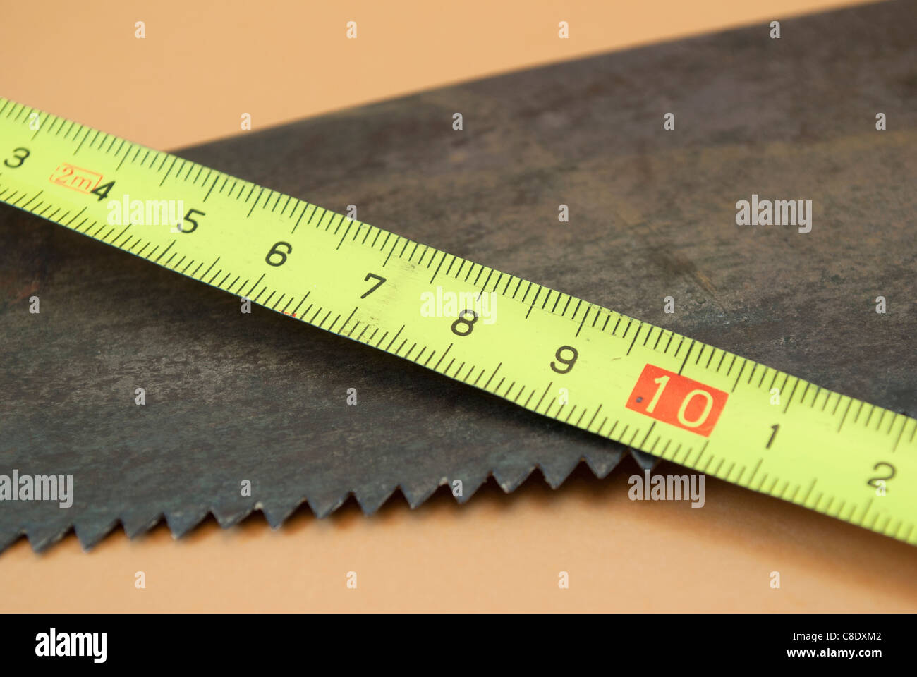 meter and hand saw Stock Photo - Alamy