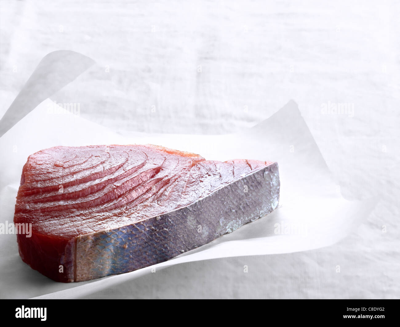 Thick piece of raw tuna Stock Photo - Alamy