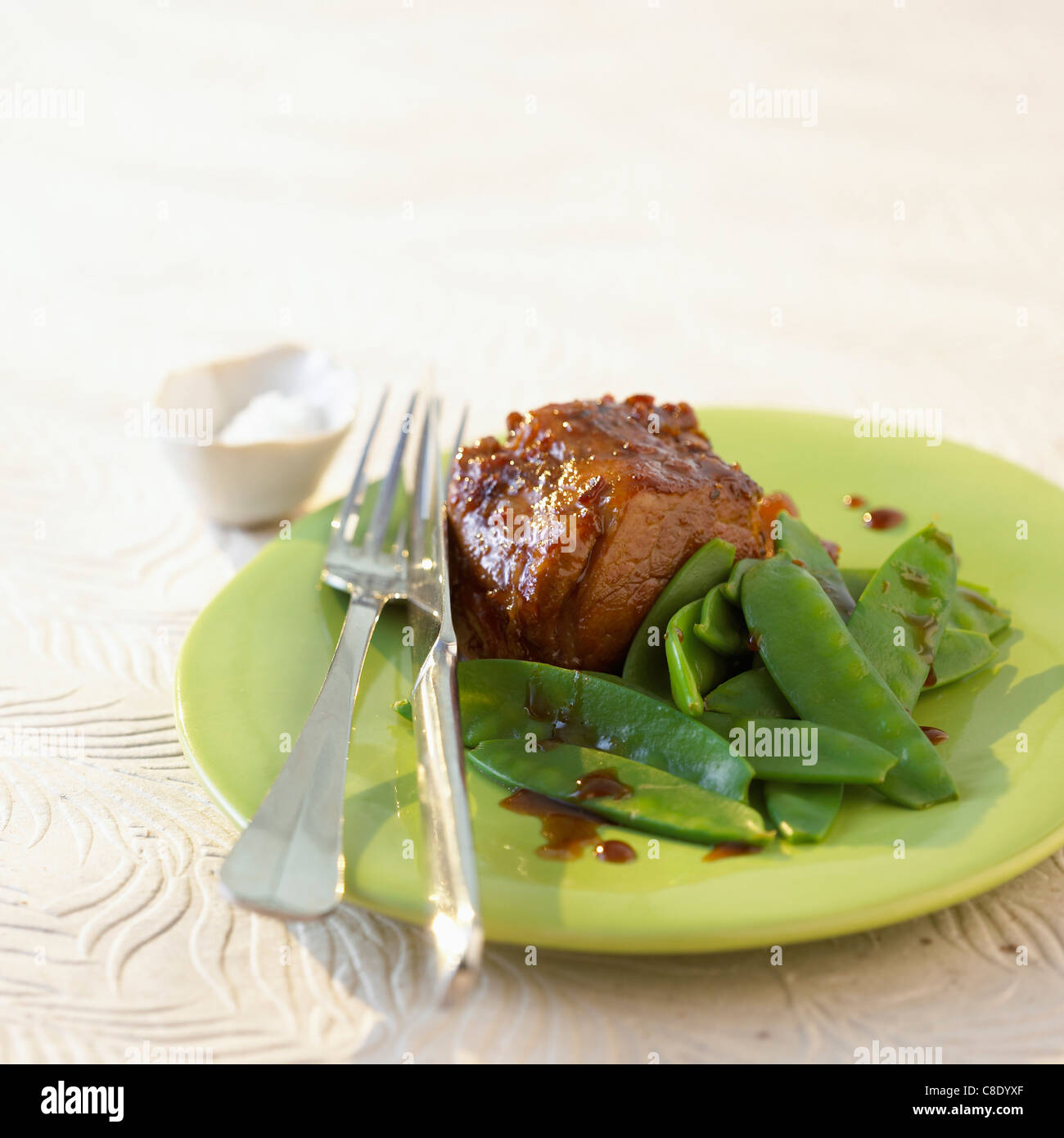 Pork filet mignon with sugar peas Stock Photo - Alamy