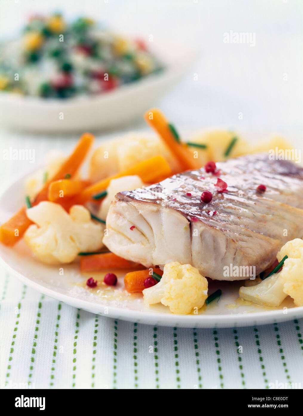 Thick piece of cod with vegetables Stock Photo - Alamy