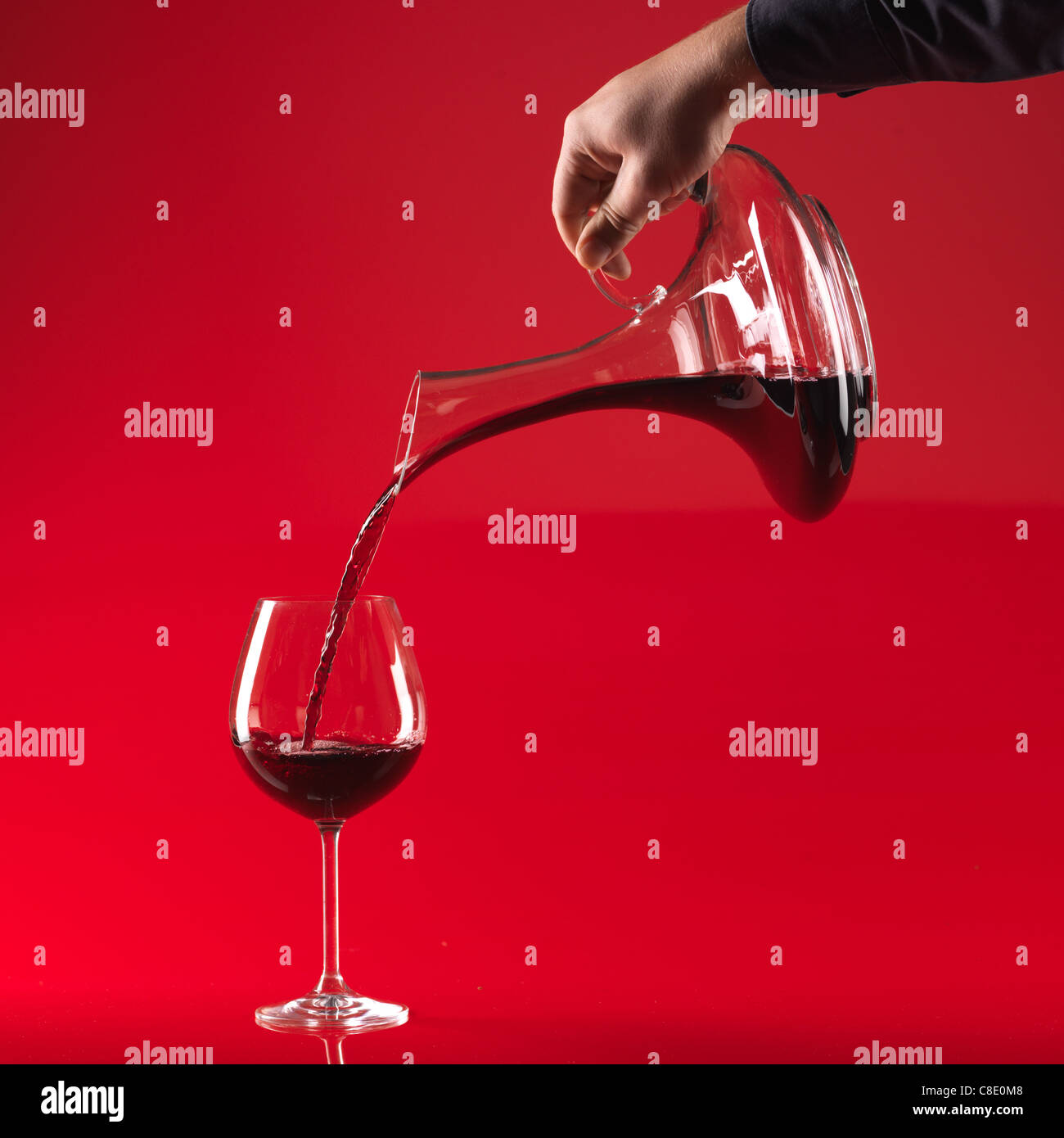 Hand holding red wine glass silhouette hi-res stock photography and ...
