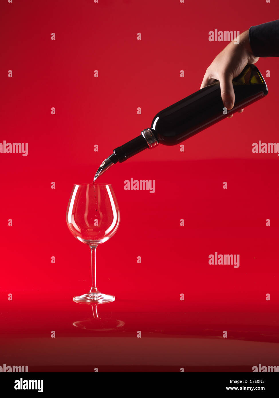 Hand holding red wine glass silhouette hi-res stock photography and ...