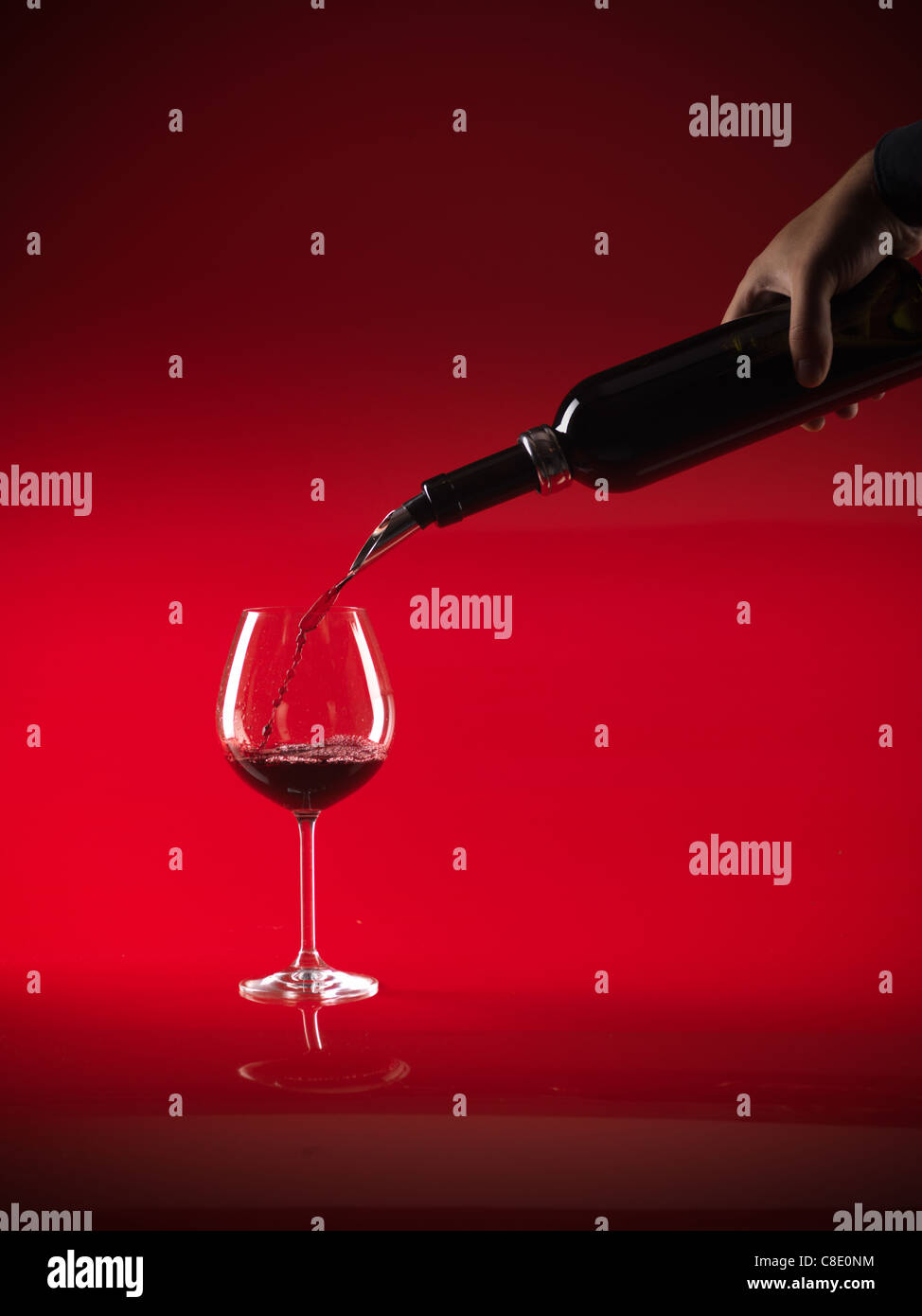 Hand holding red wine glass silhouette hi-res stock photography and ...