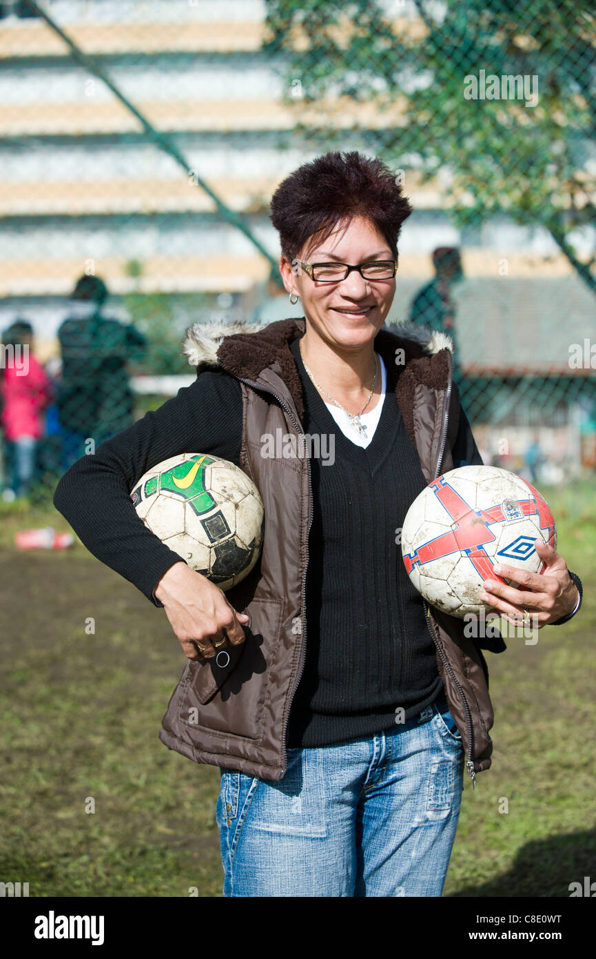 Supporter carrying two footballs Rygersdal Football club Cape Town ...
