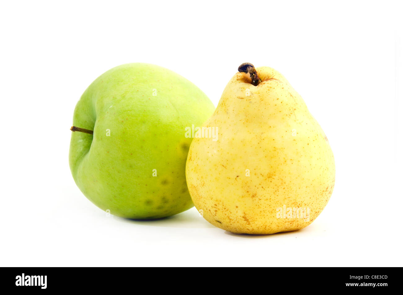 Juicy yellow pear and green apple over a white background Stock Photo ...