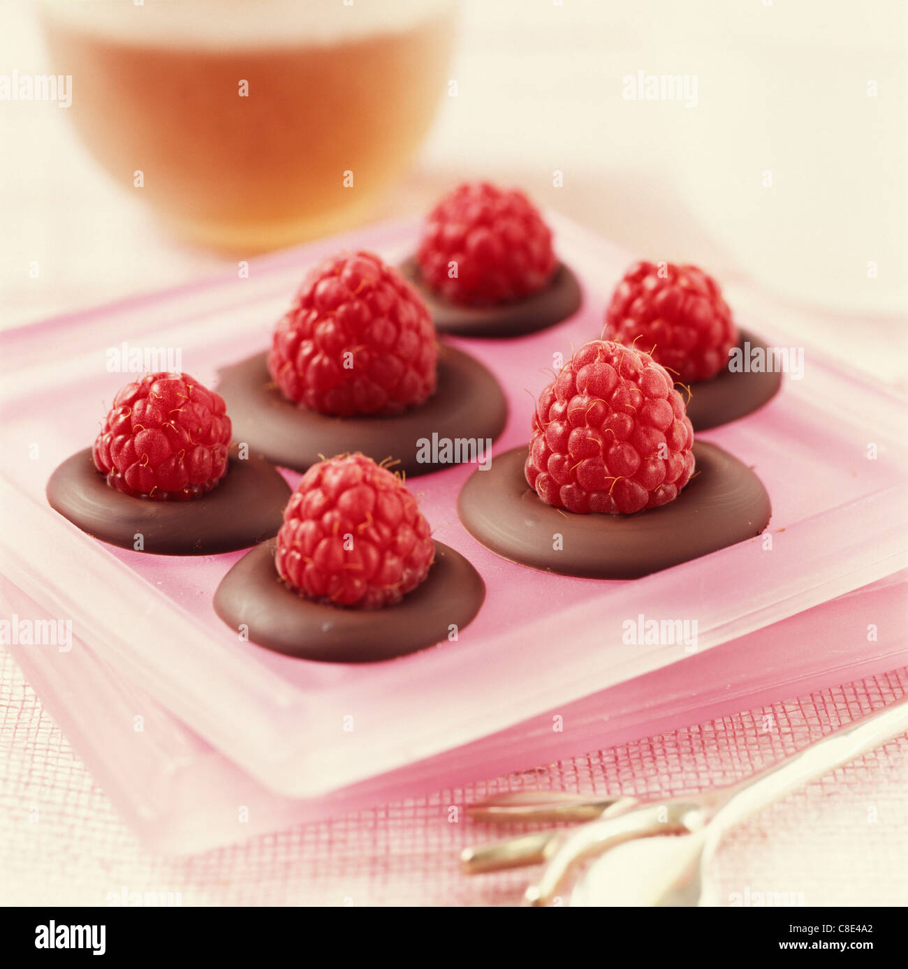 Chocolate and raspberry dots Stock Photo - Alamy