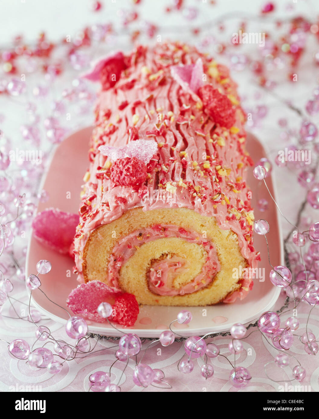 Pink praline log cake Stock Photo - Alamy