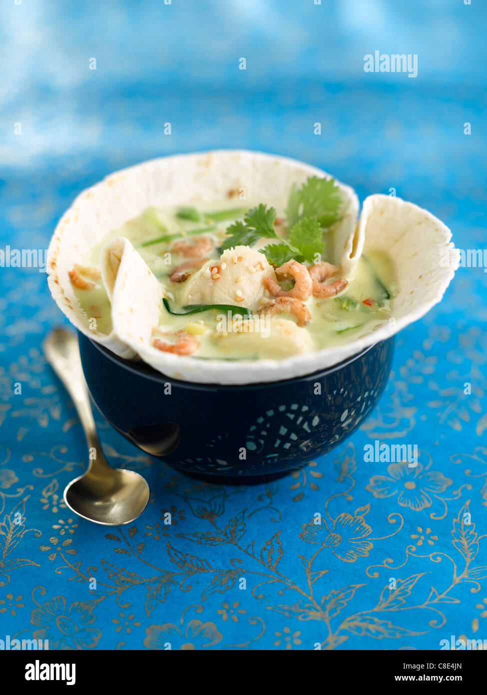 Fish soup served in a tortilla cone Stock Photo - Alamy