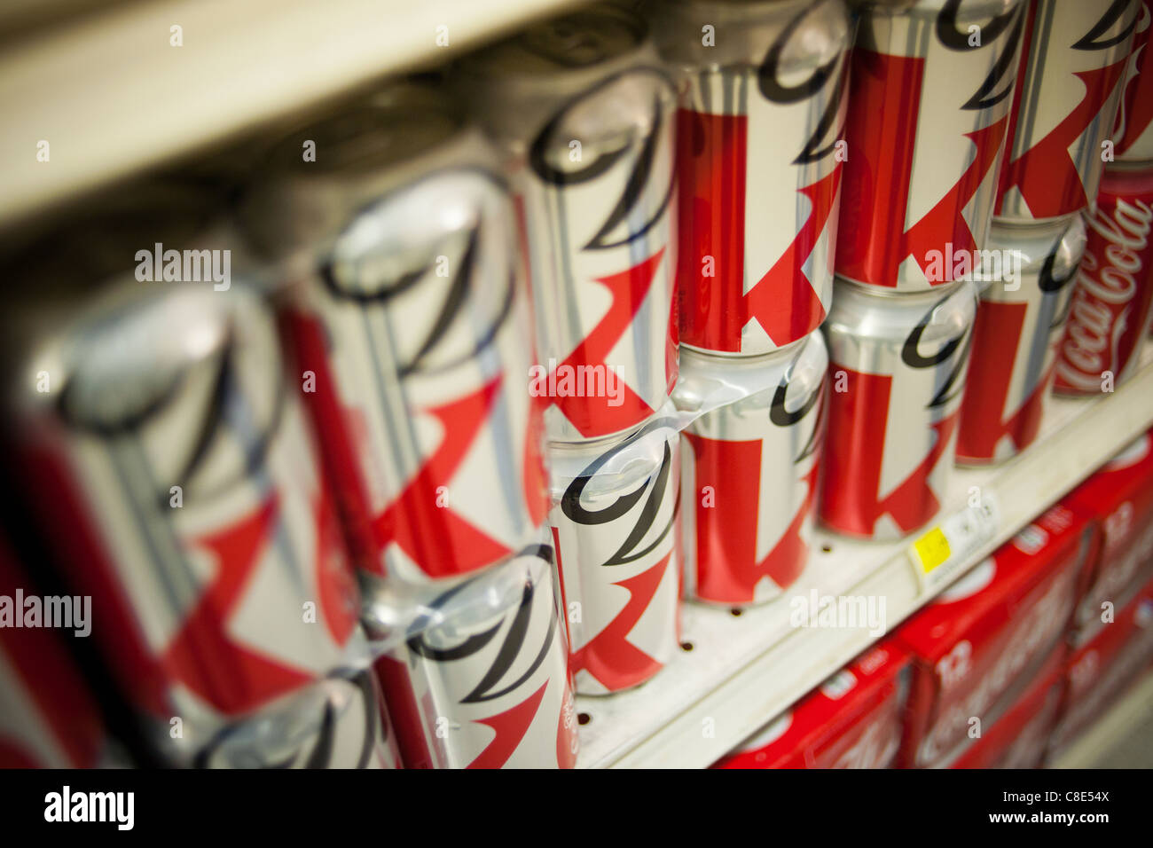 Six-packs of cans of Coca-Cola in a supermarket in New York Stock Photo ...