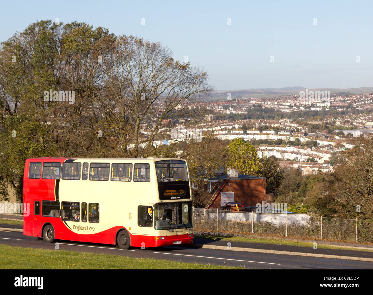 A Brighton & Hove bus being driven near the racecourse with the streets ...