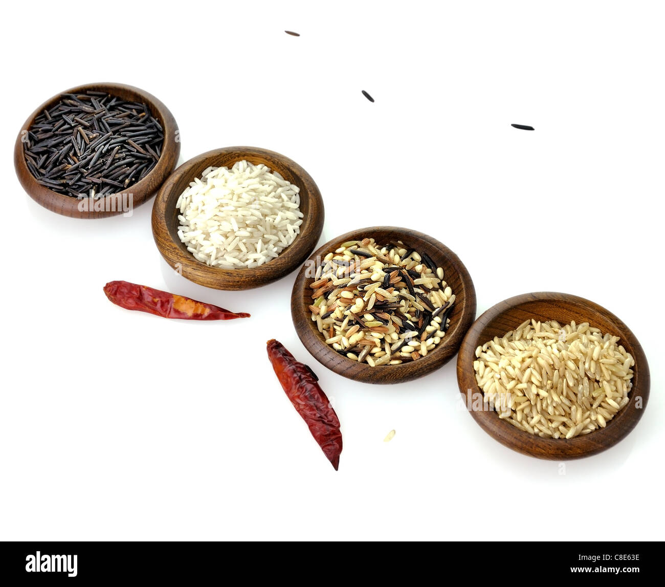 assortment of rice in wooden bowls on white background Stock Photo - Alamy