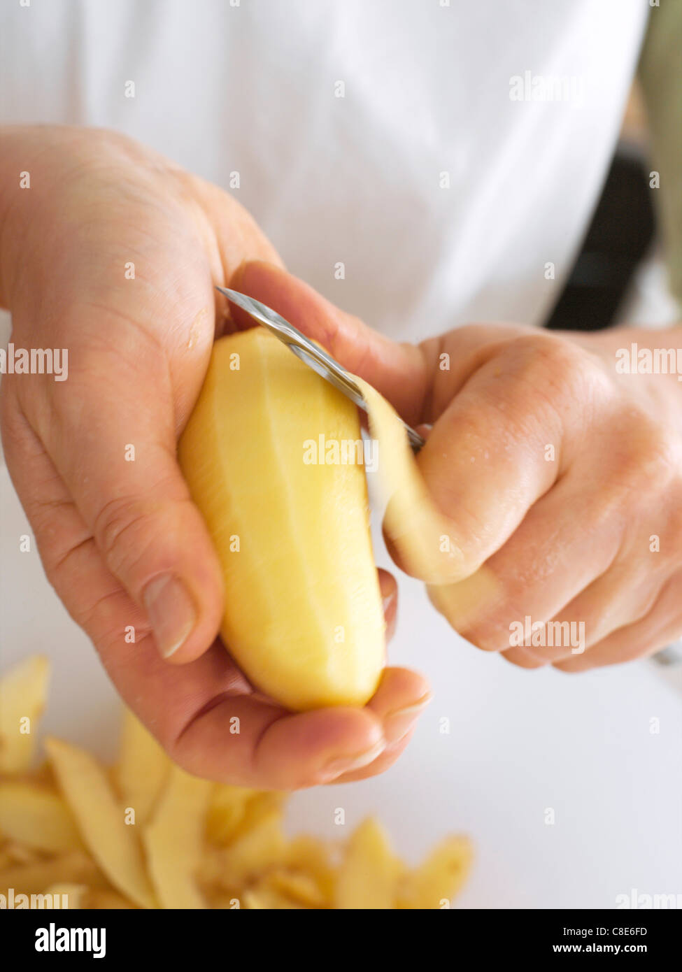Peeling a potato Stock Photo - Alamy