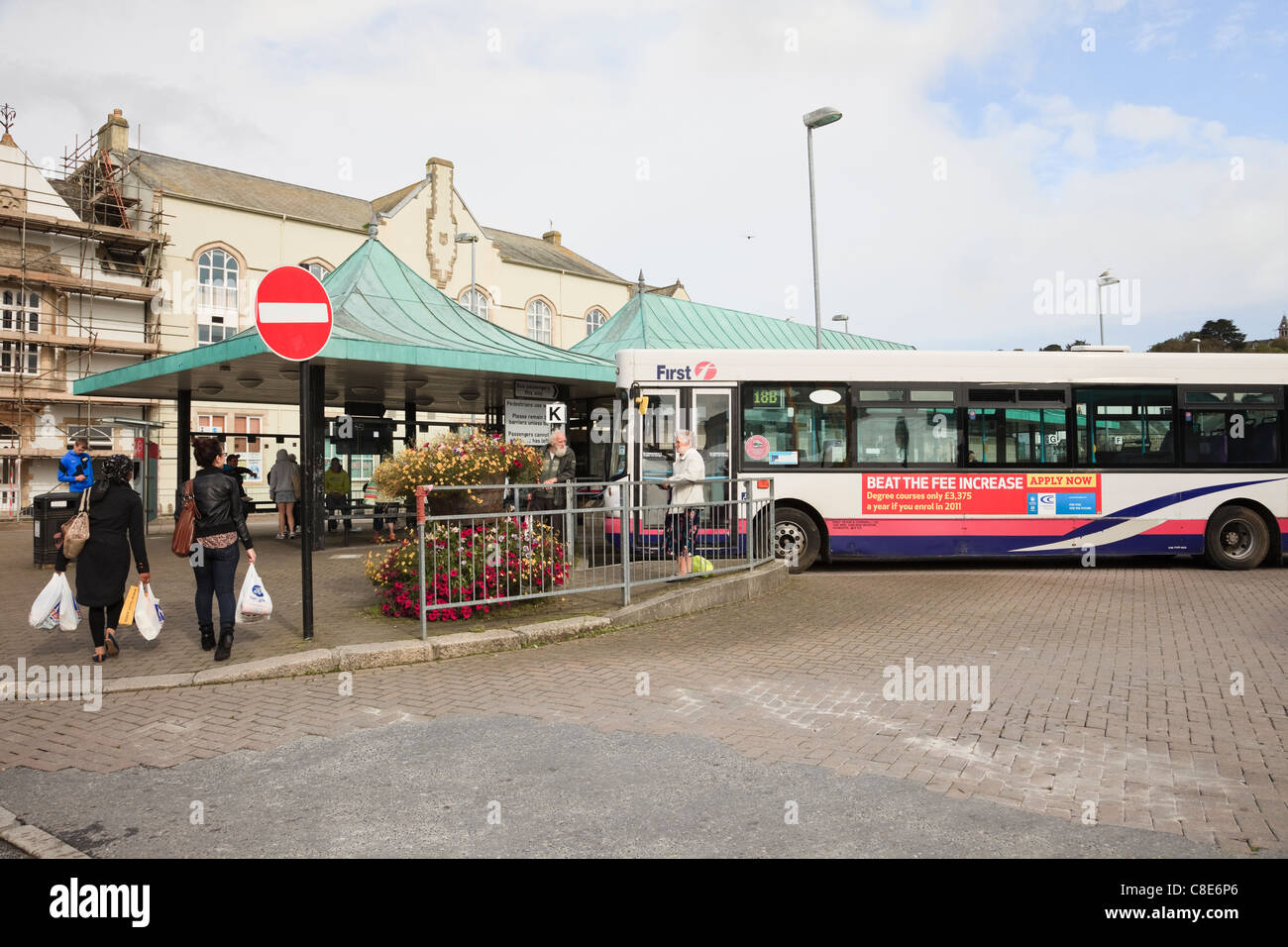 First Bus in the city centre bus station with passengers waiting. Truro ...