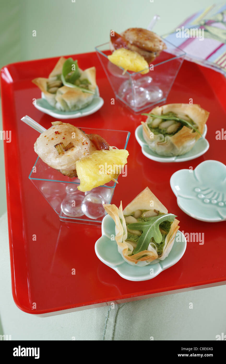 Flaky pastry starters with scallop brochettes Stock Photo - Alamy