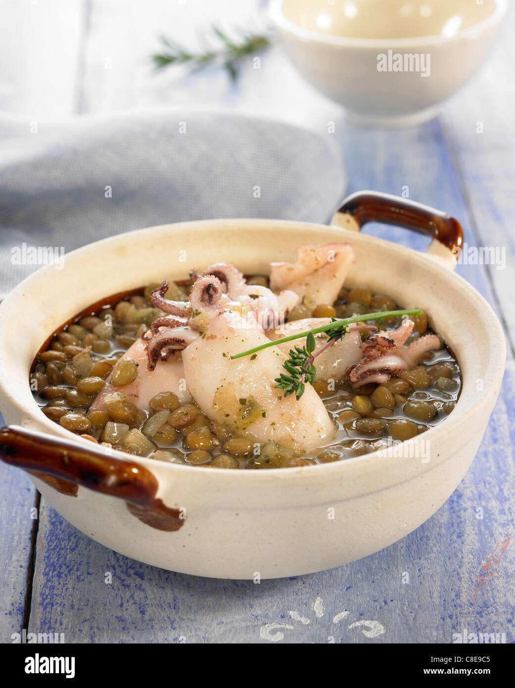 Small squid with lentils Stock Photo - Alamy