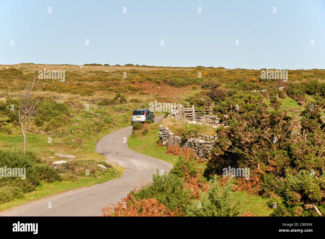 Car driving down long winding road hi-res stock photography and images ...